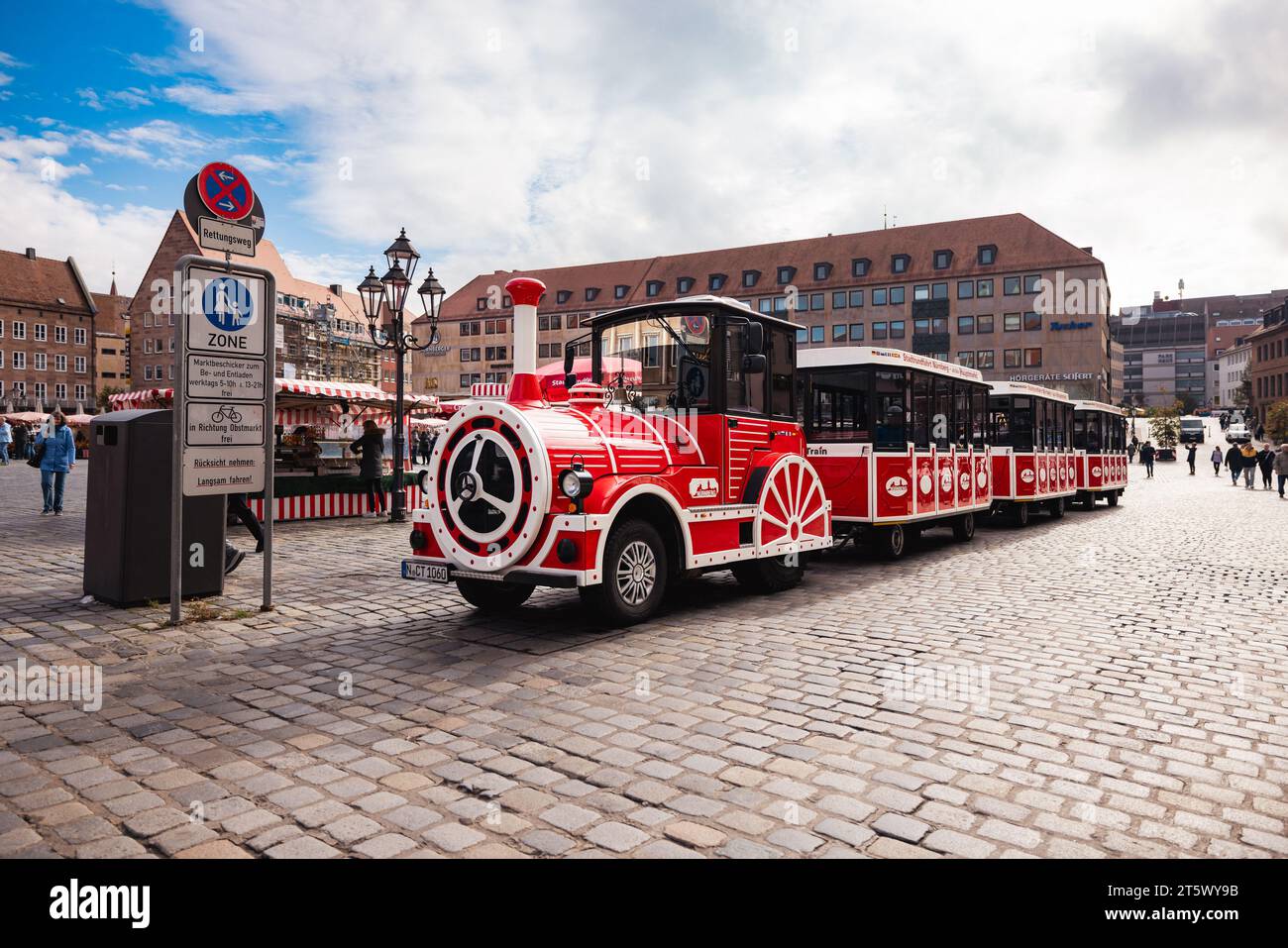 Nuremberg, Germany - October 25, 2023: Red tourist trolley takes ...