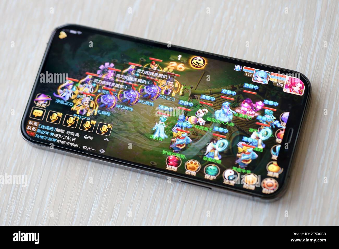 Fantasy Westward Journey mobile iOS game on iPhone 15 smartphone screen ...