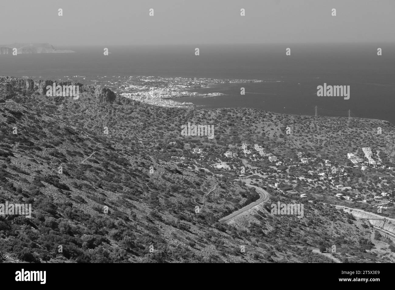 Black and White image of Malia bay with Heraclium in the distance ...