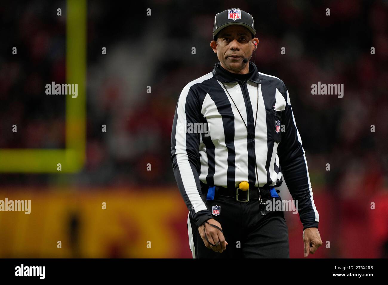 Line judge Greg Bradley (98) walks on the field during an NFL football ...