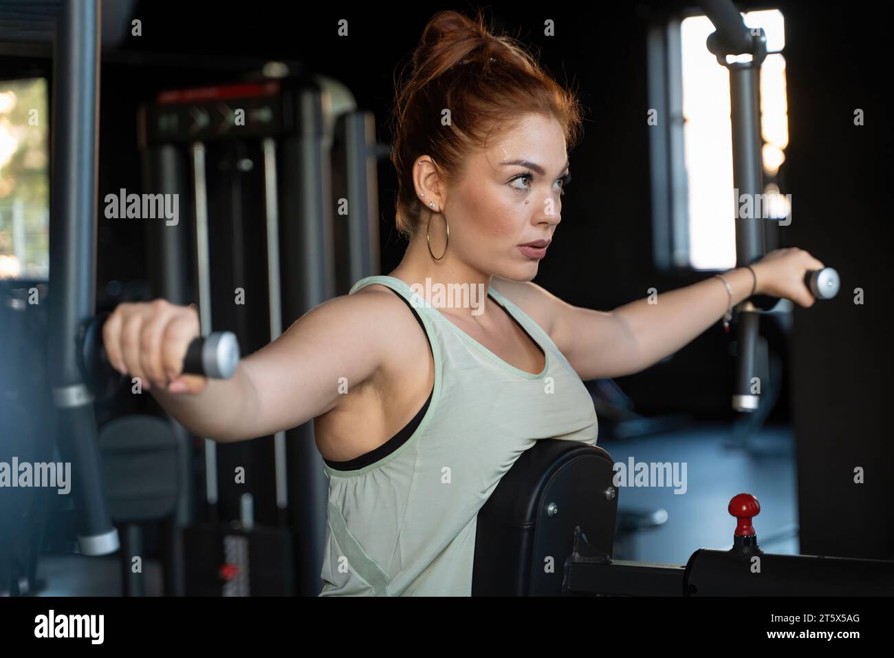 A young woman is captured in a moment of concentration and dedication ...