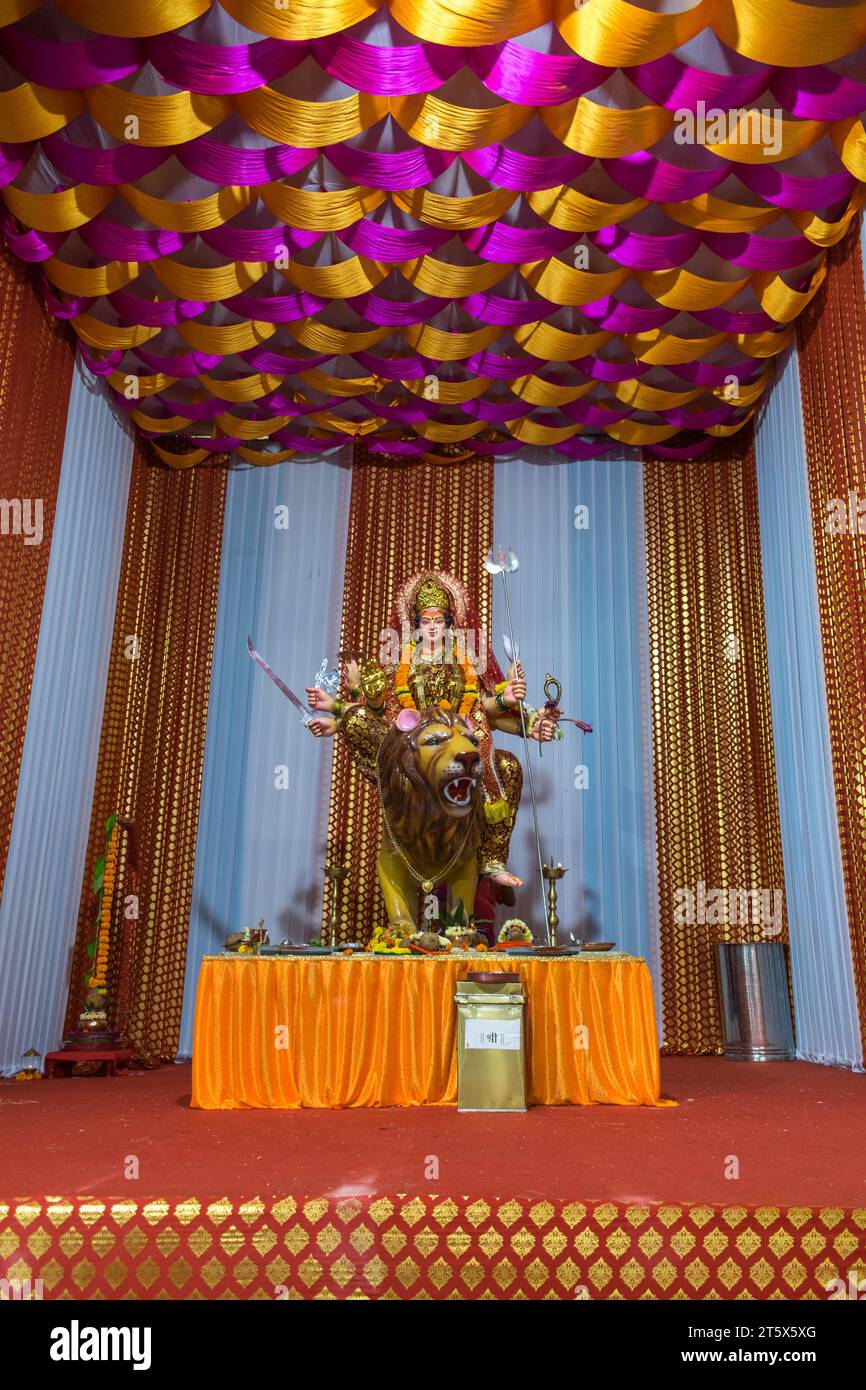 A beautiful idol of Maa Durga being worshipped at a pandal during ...