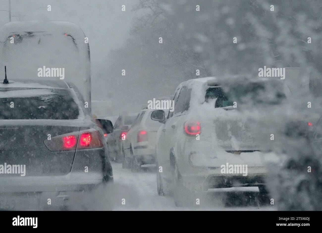 Winter traffic jam on the snowy road through wet windshield Stock Photo ...