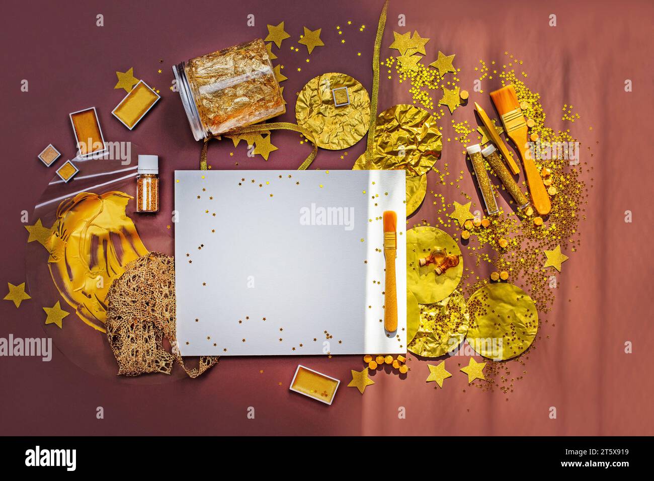 Bright golden objects for creativity and art projects. White canvas ...