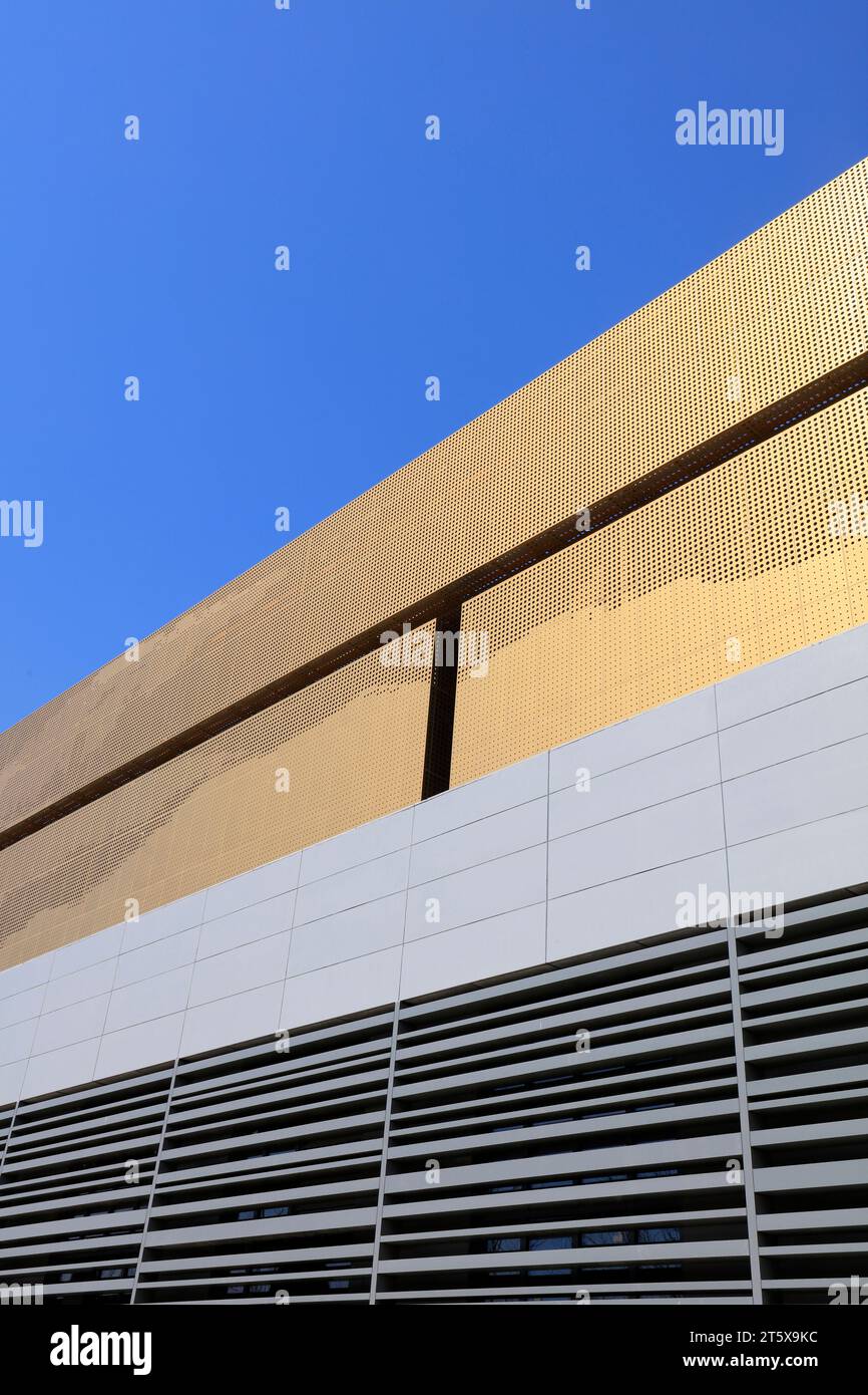 Yellow metal exterior wall decoration Stock Photo - Alamy