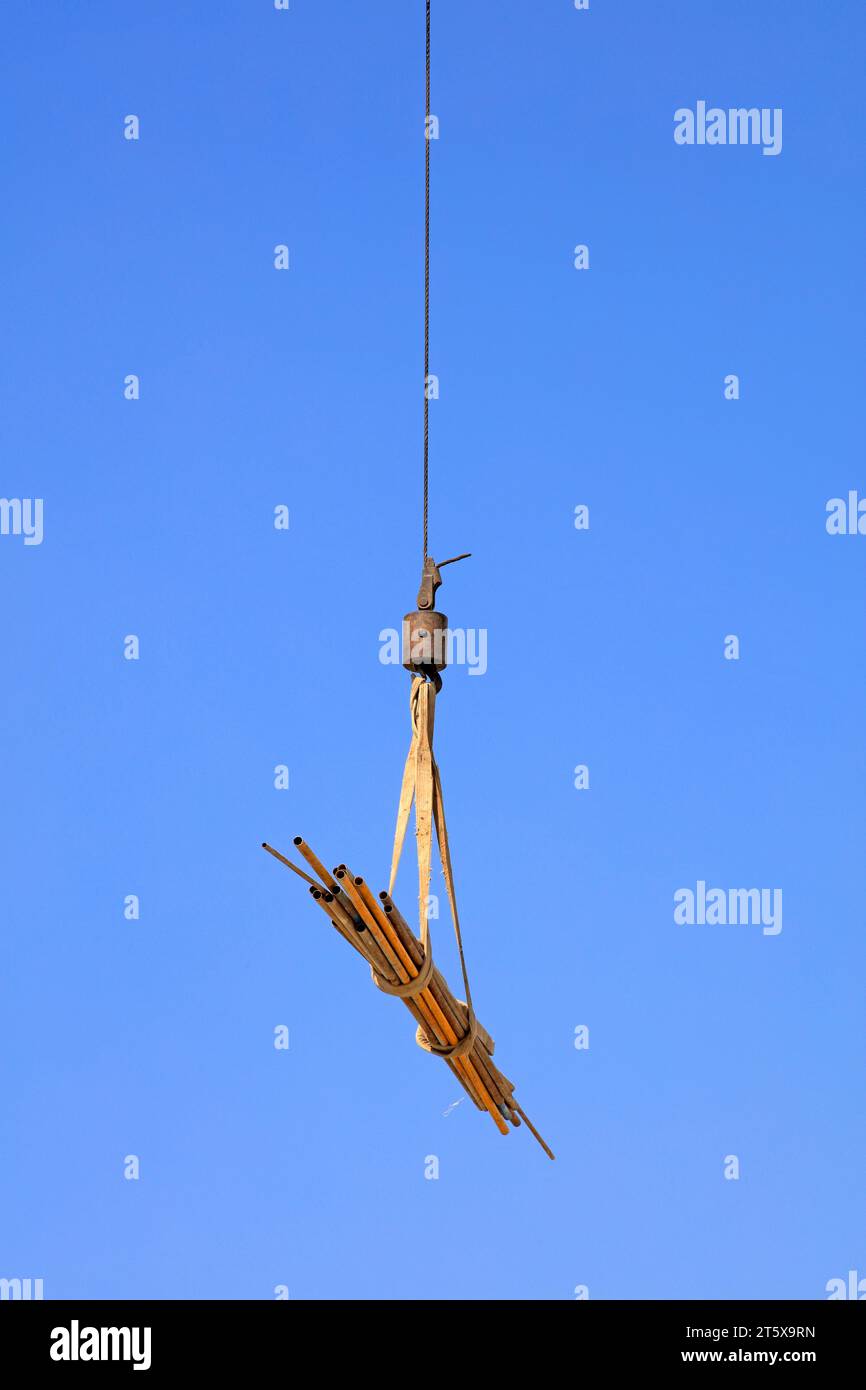 Hoisting steel pipe for crane Stock Photo - Alamy