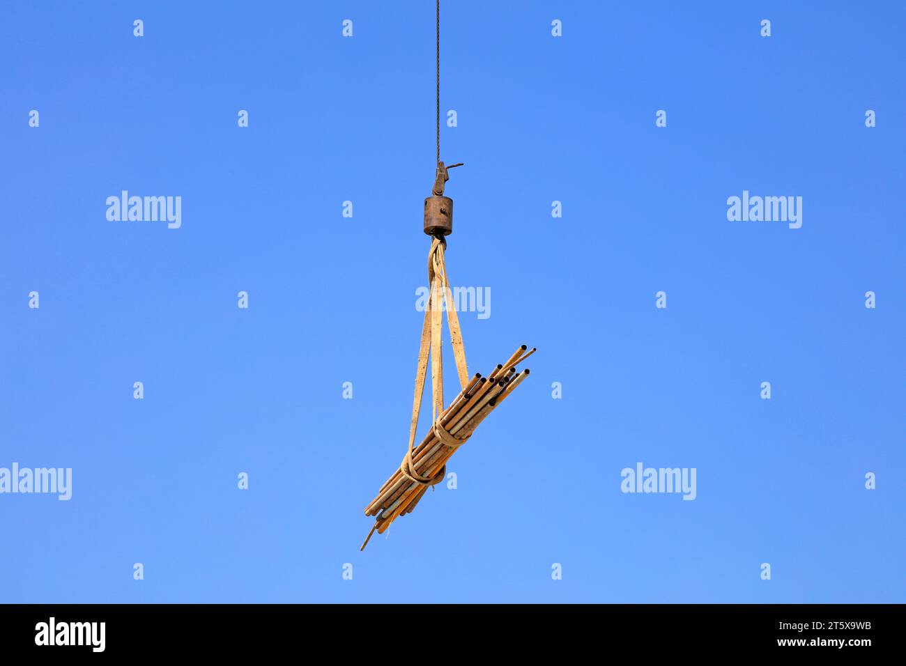Hoisting steel pipe for crane Stock Photo - Alamy
