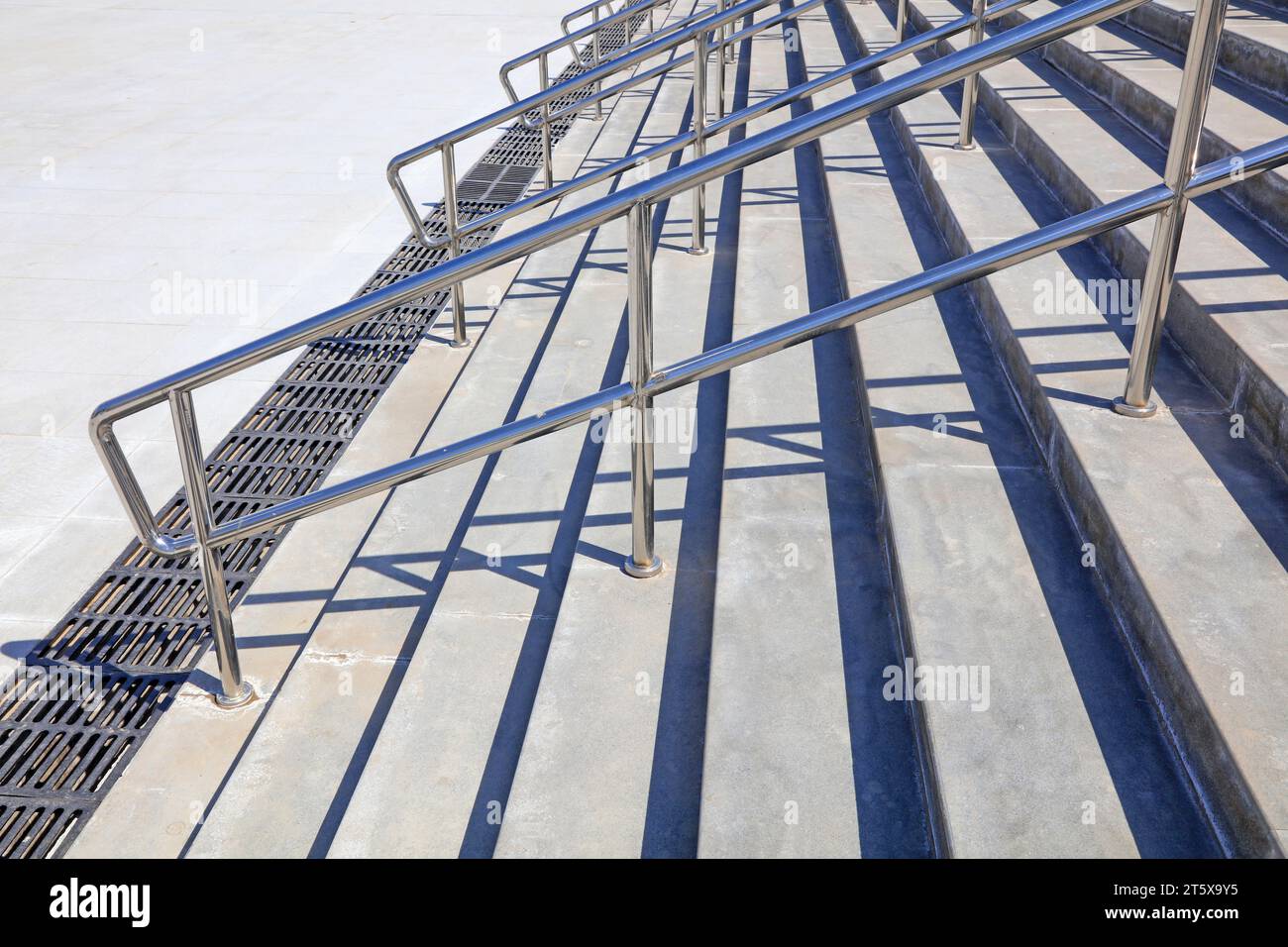 Steps and stainless steel railings Stock Photo - Alamy