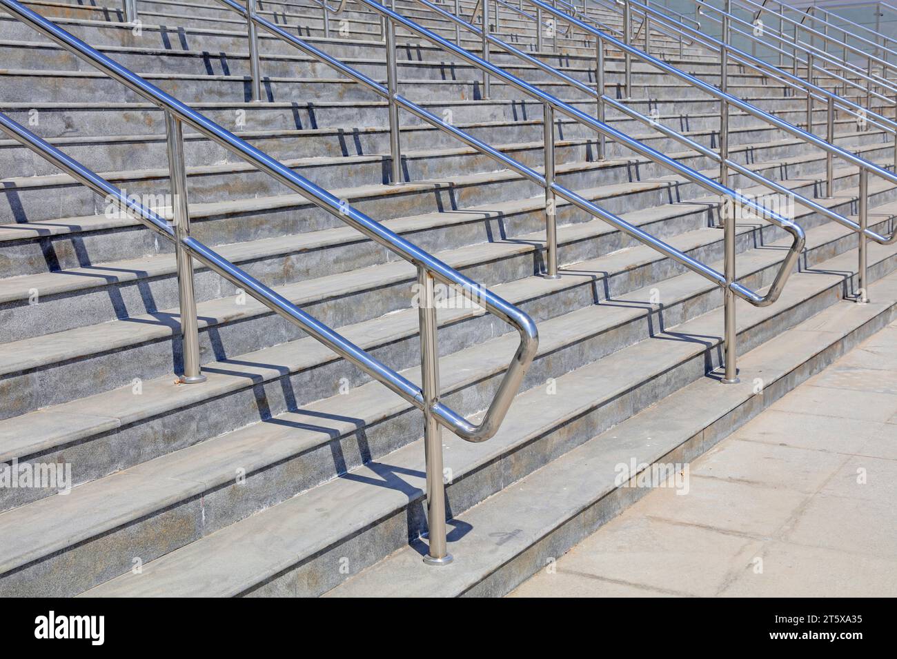 Steps and stainless steel railings Stock Photo - Alamy