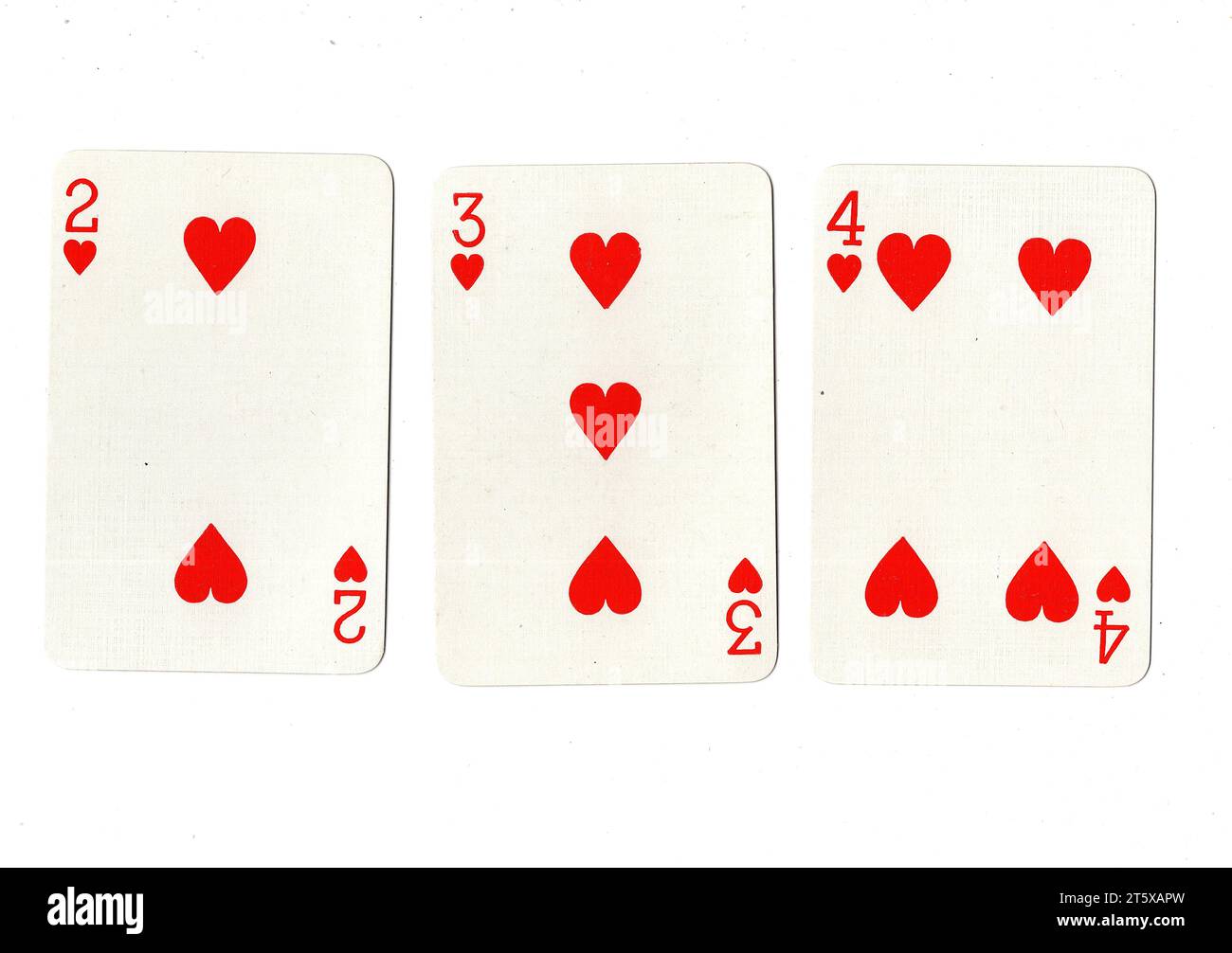 A selection of three vintage playing cards showing a run of two, three ...