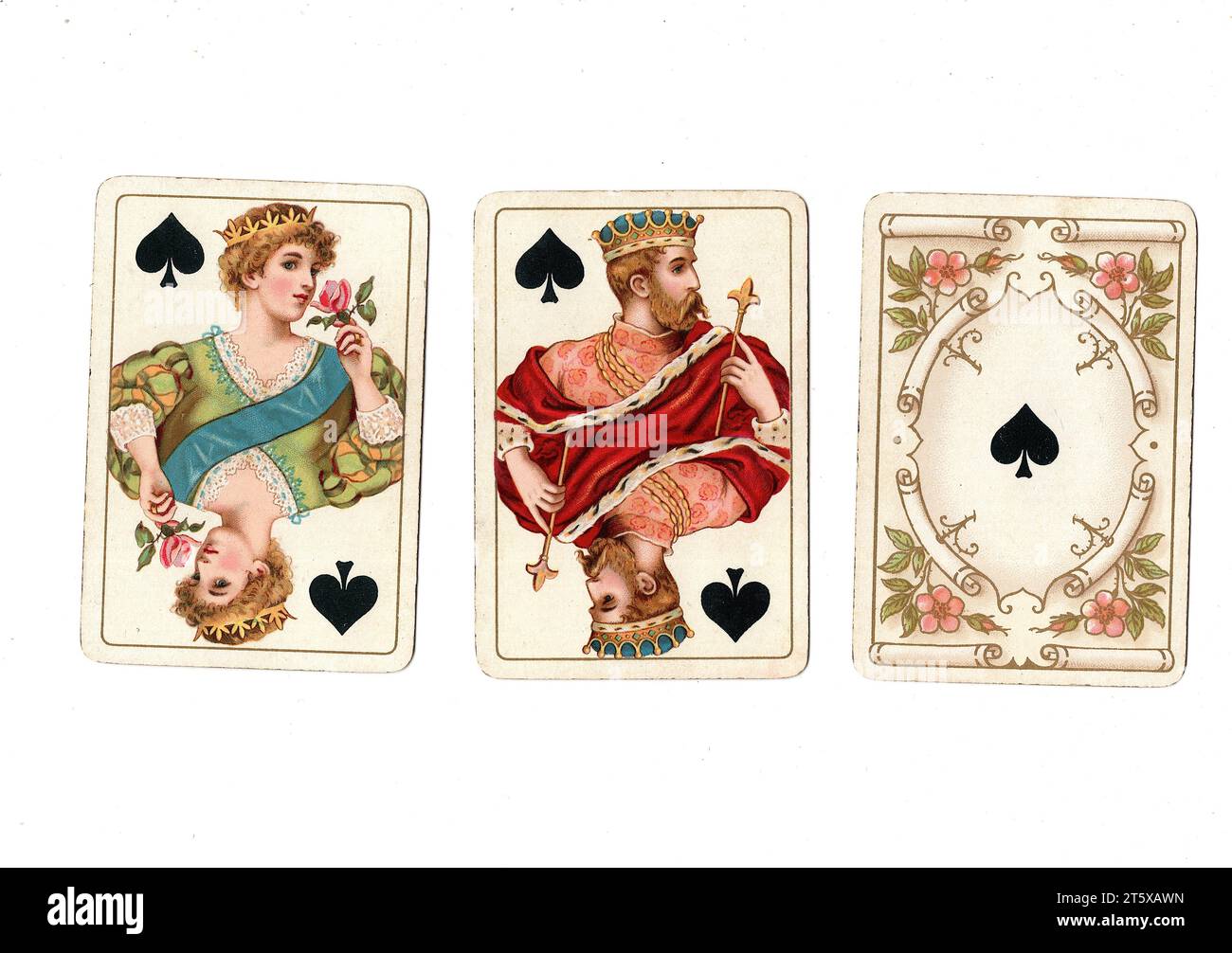 Three antique playing cards showing a queen, king and ace of spades on ...