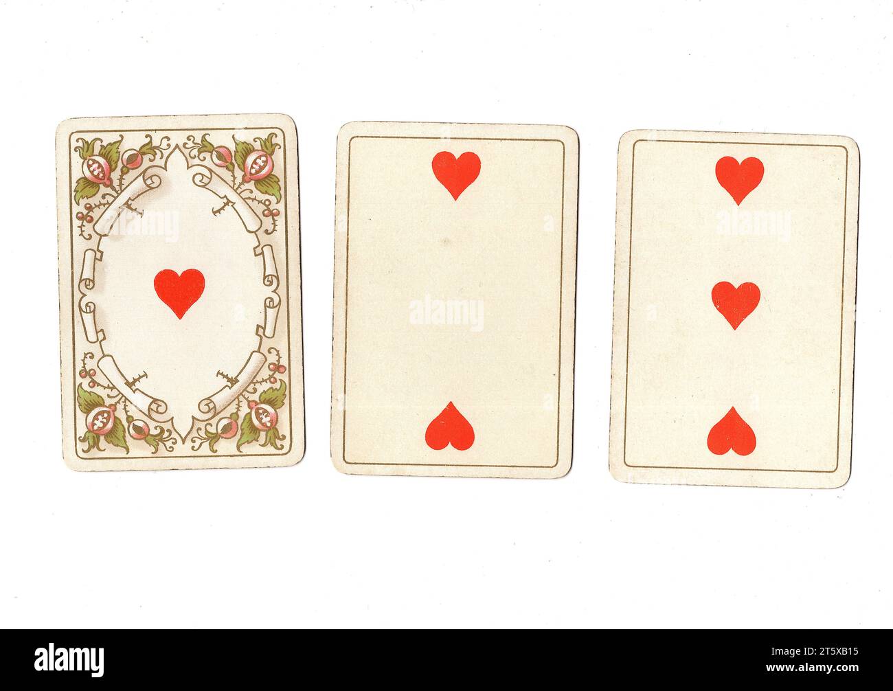 Three antique playing cards showing an ace, two and three of hearts on ...