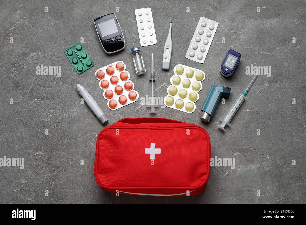 First aid kit and pills on grey background Stock Photo - Alamy