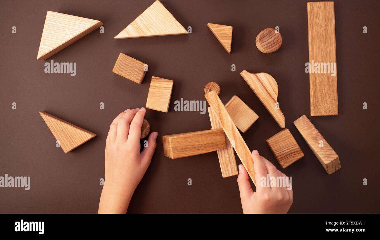 Child hands playing with wooden blocks Stock Photo - Alamy
