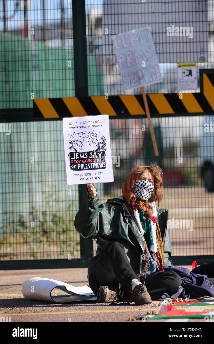 An activist holds a sign saying 'Jews Say Stop Genocide of Civilians ...