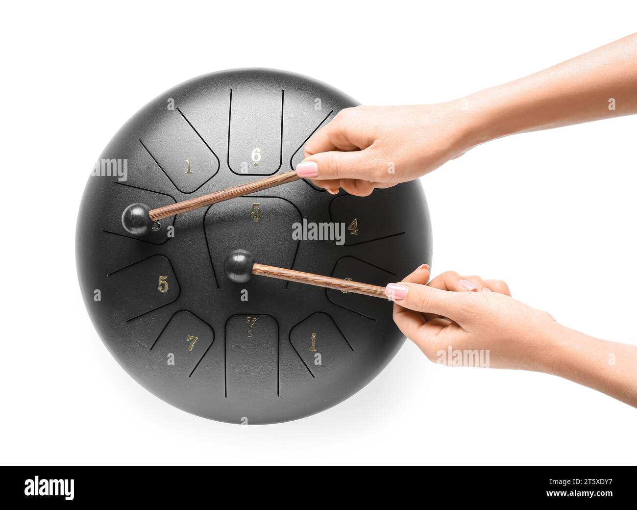 Female hands with sticks playing glucophone on white background Stock ...