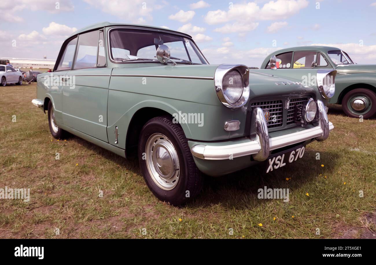 Three-quarters front view of a 1962, Green, Triumph Herald 1200 Saloon ...