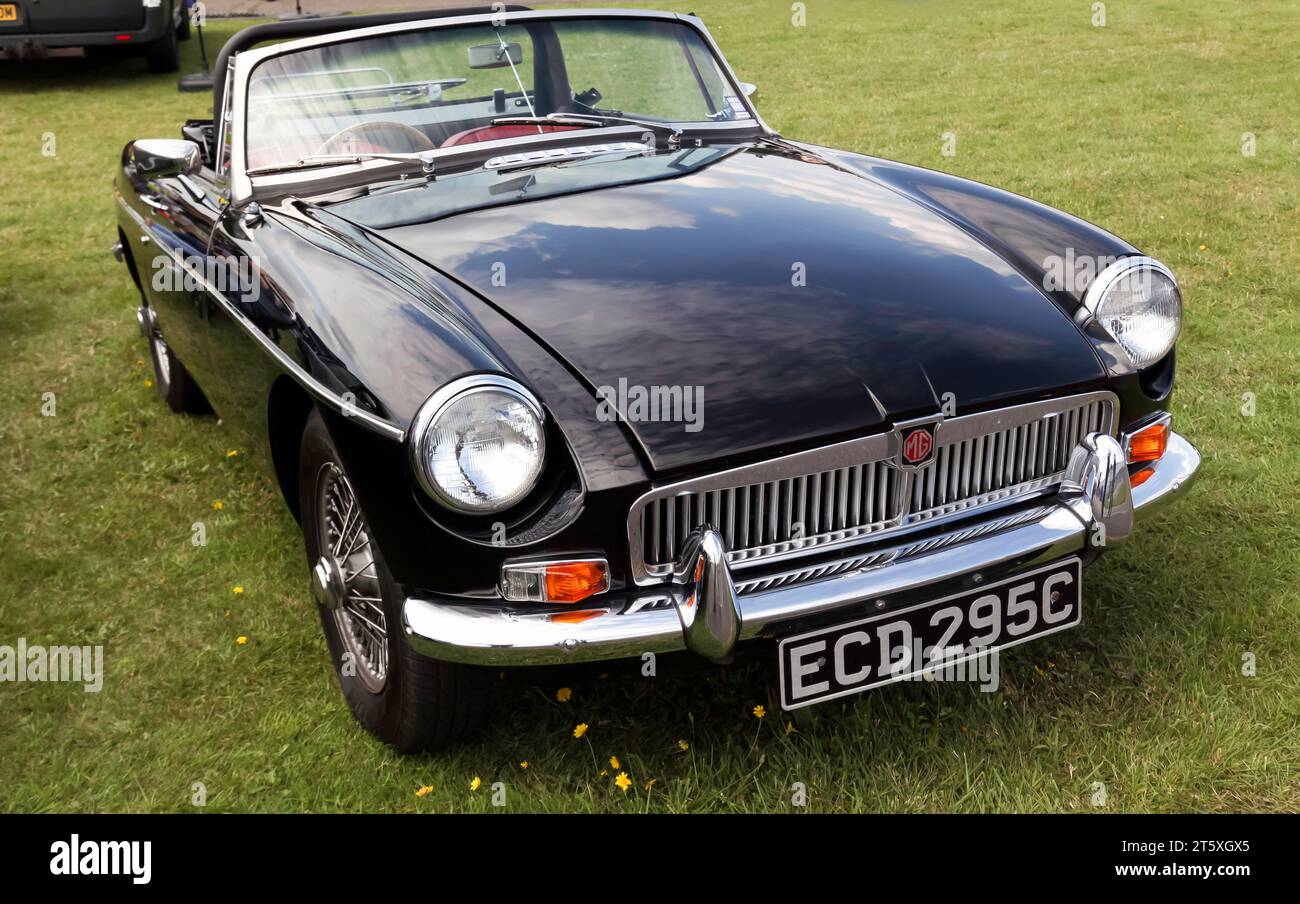 Three-quarters front view of a 1965, Black, MGB roadster, on display at ...