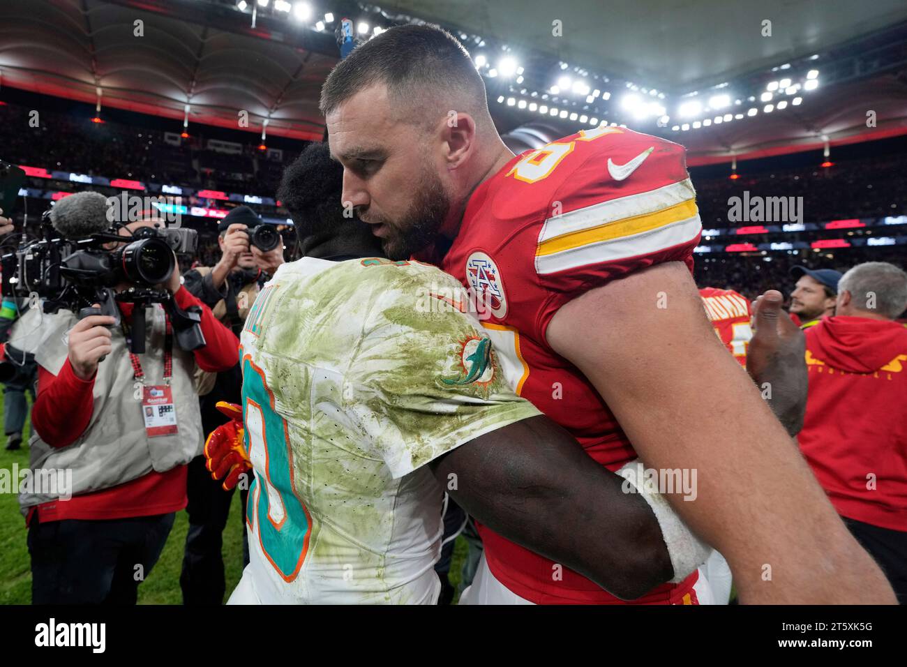 Kansas City Chiefs tight end Travis Kelce, (87) greets former teammate and Miami Dolphins wide ...