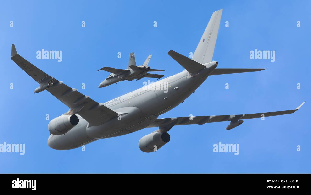 A Finnish F/A-18C Hornet fighter jet flies alongside a British RAF ...