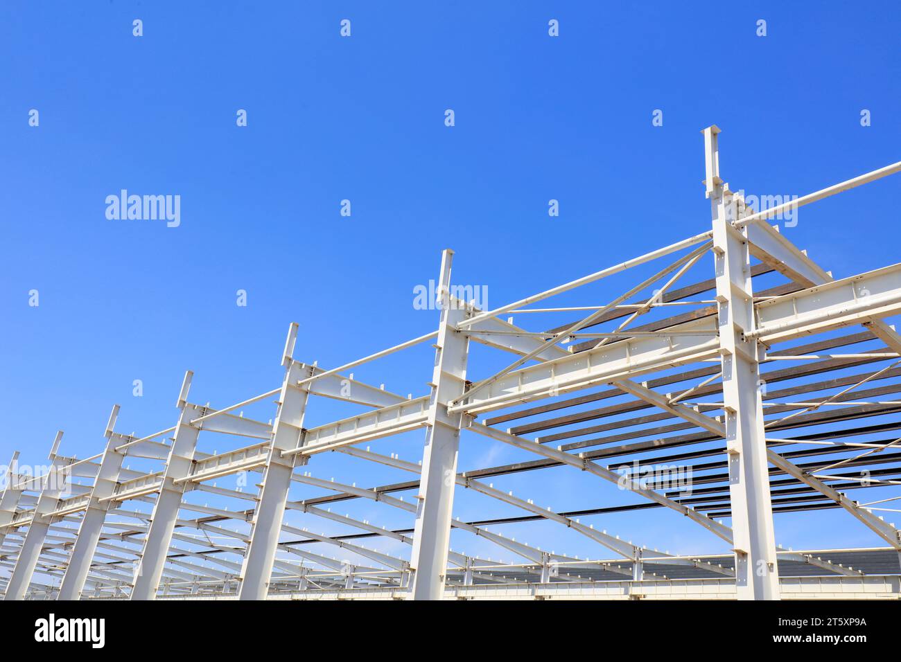 steel girder truss under blue sky, closeup of photo Stock Photo - Alamy