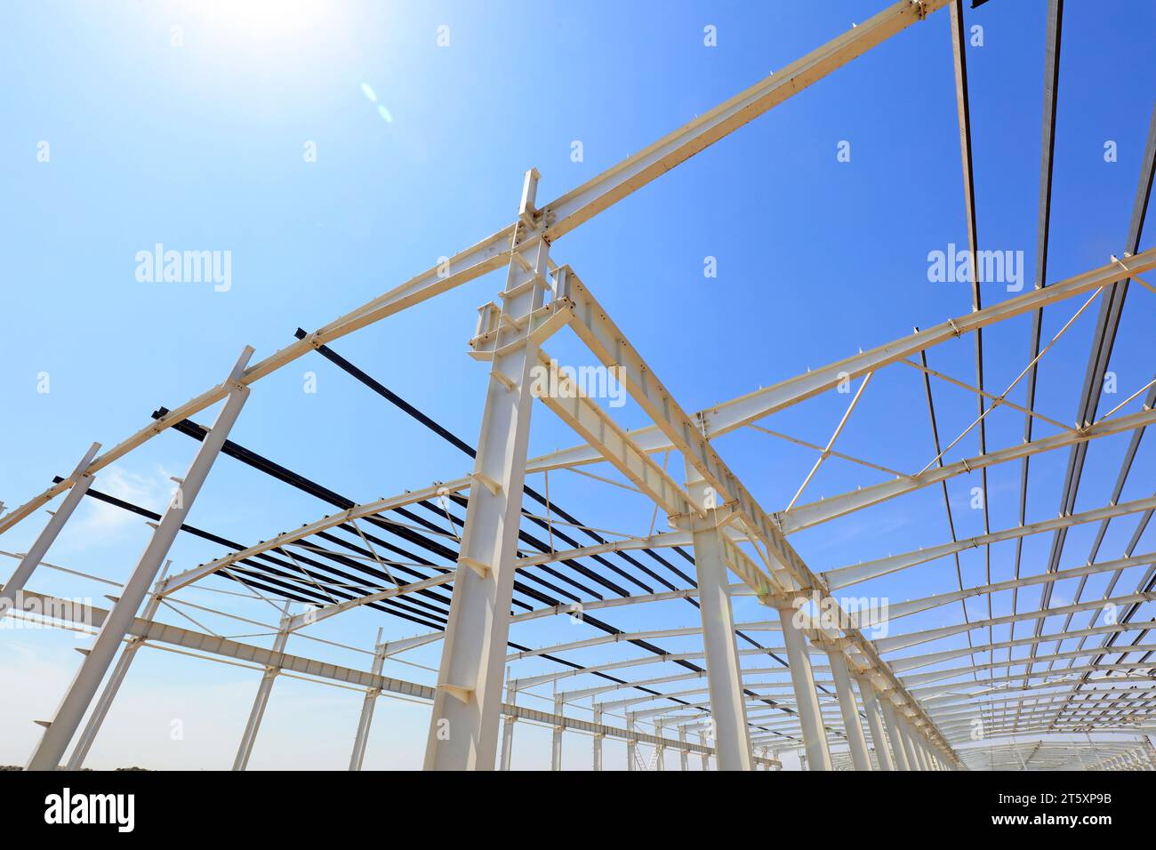 steel girder truss under blue sky, closeup of photo Stock Photo - Alamy