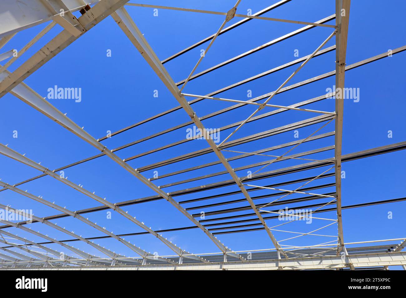 steel girder truss under blue sky, closeup of photo Stock Photo - Alamy