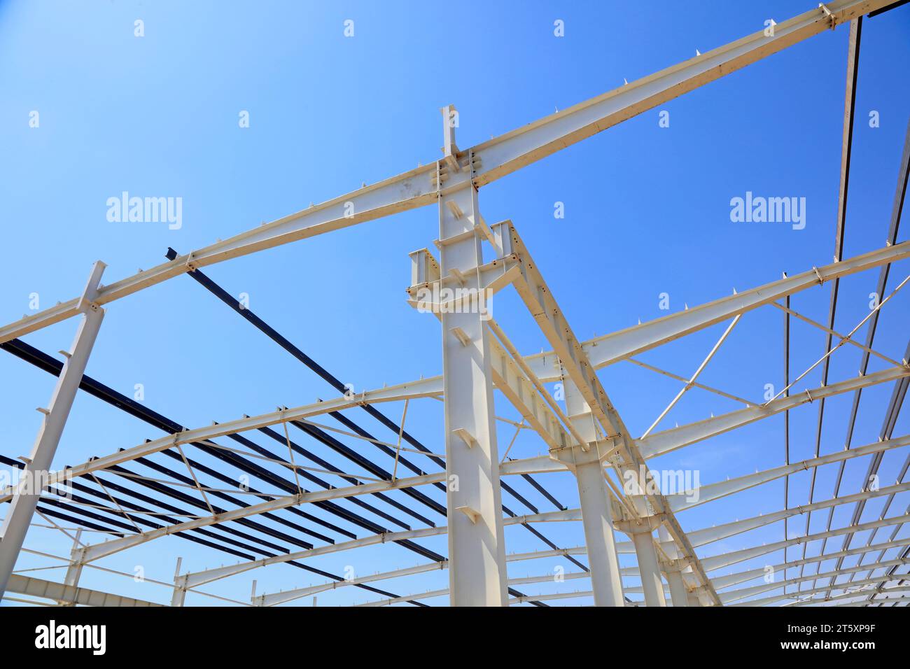 steel girder truss under blue sky, closeup of photo Stock Photo - Alamy
