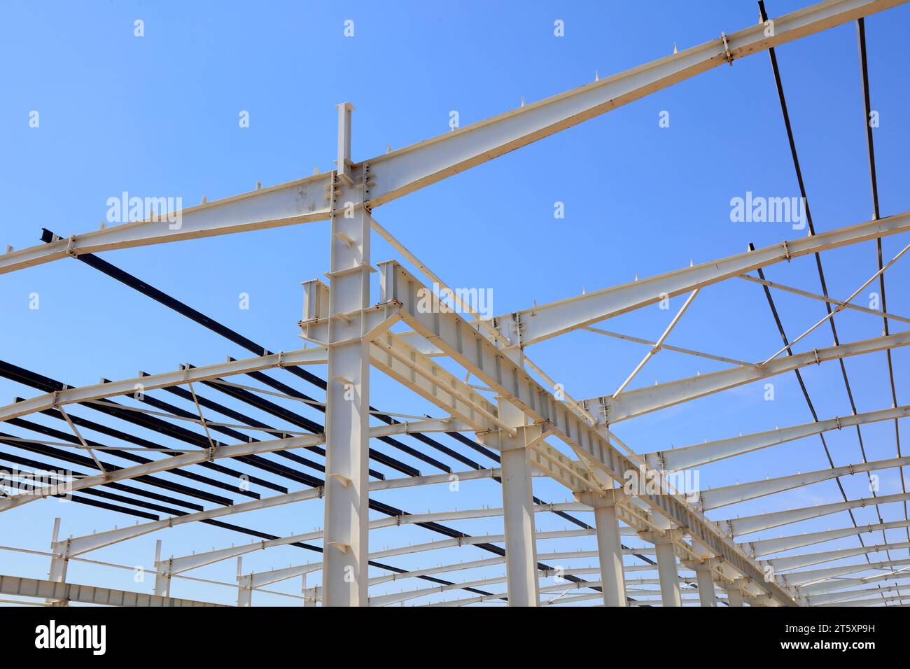 steel girder truss under blue sky, closeup of photo Stock Photo - Alamy