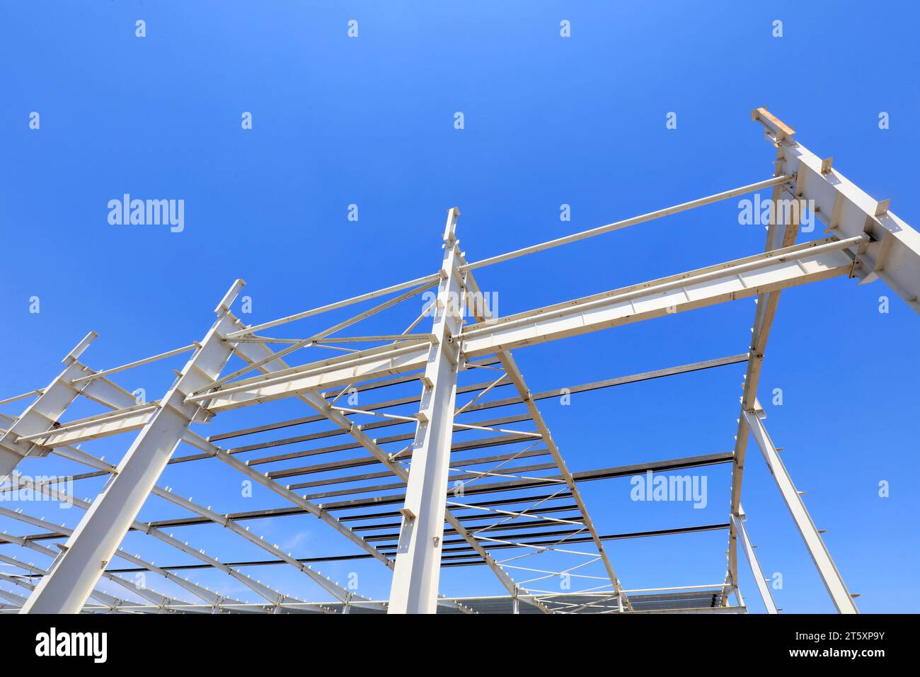 steel girder truss under blue sky, closeup of photo Stock Photo - Alamy