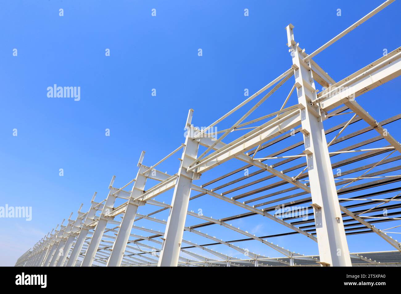 steel girder truss under blue sky, closeup of photo Stock Photo - Alamy