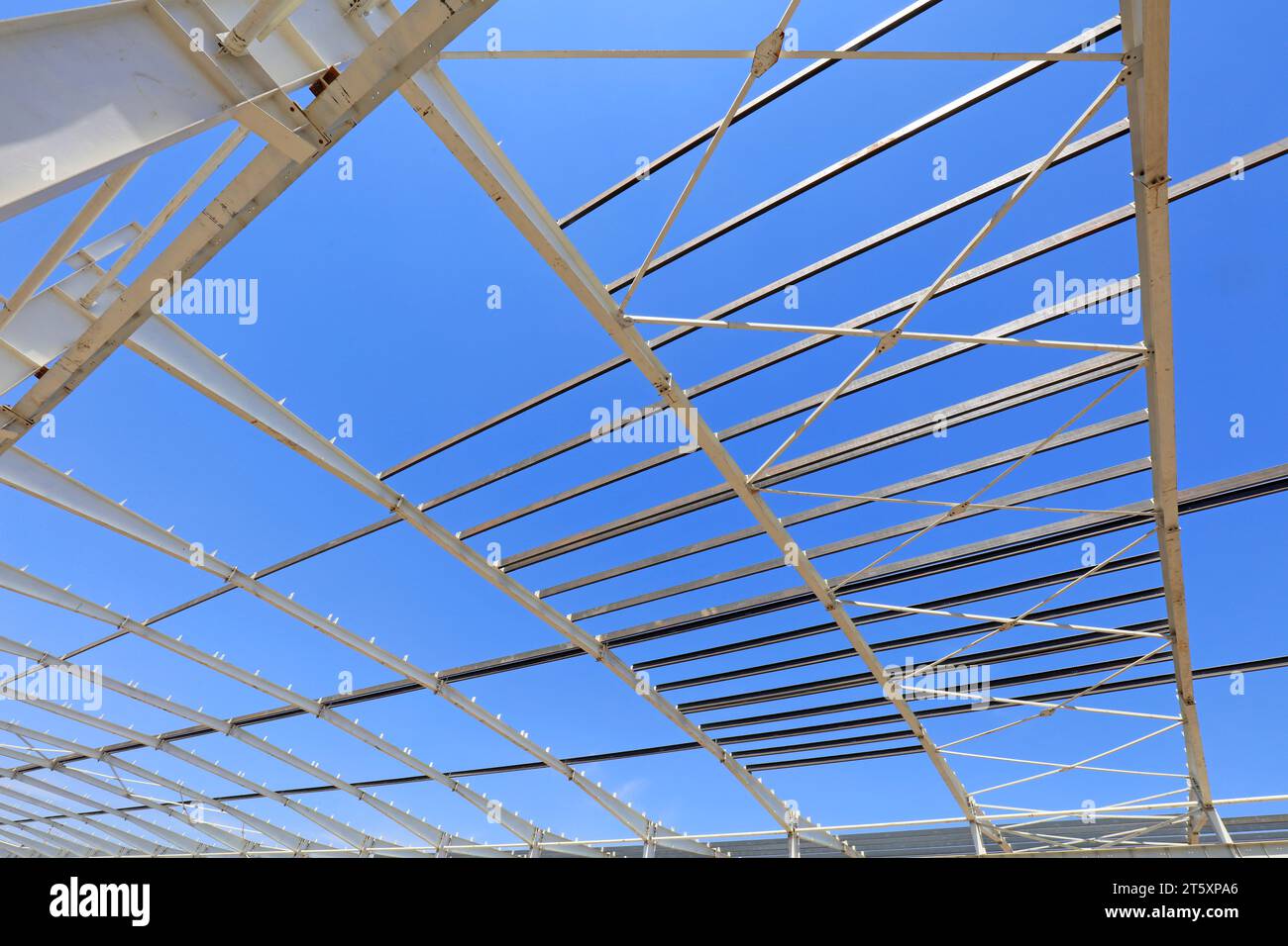 steel girder truss under blue sky, closeup of photo Stock Photo - Alamy