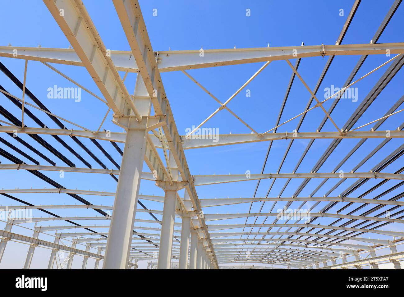 steel girder truss under blue sky, closeup of photo Stock Photo - Alamy