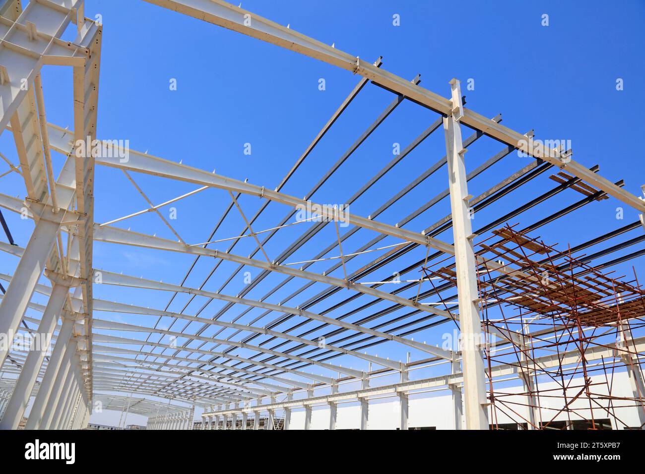 steel girder truss under blue sky, closeup of photo Stock Photo - Alamy