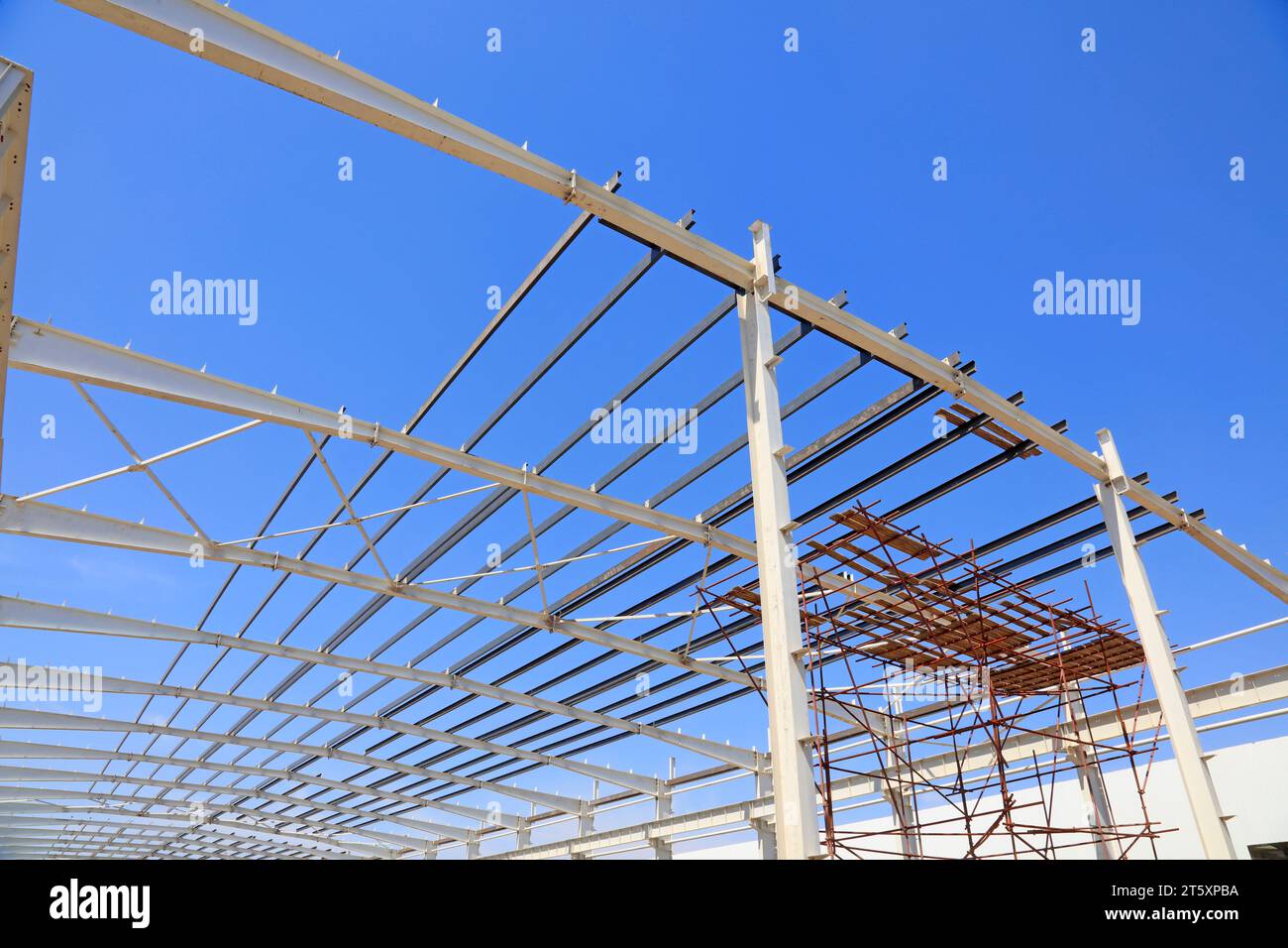 steel girder truss under blue sky, closeup of photo Stock Photo - Alamy