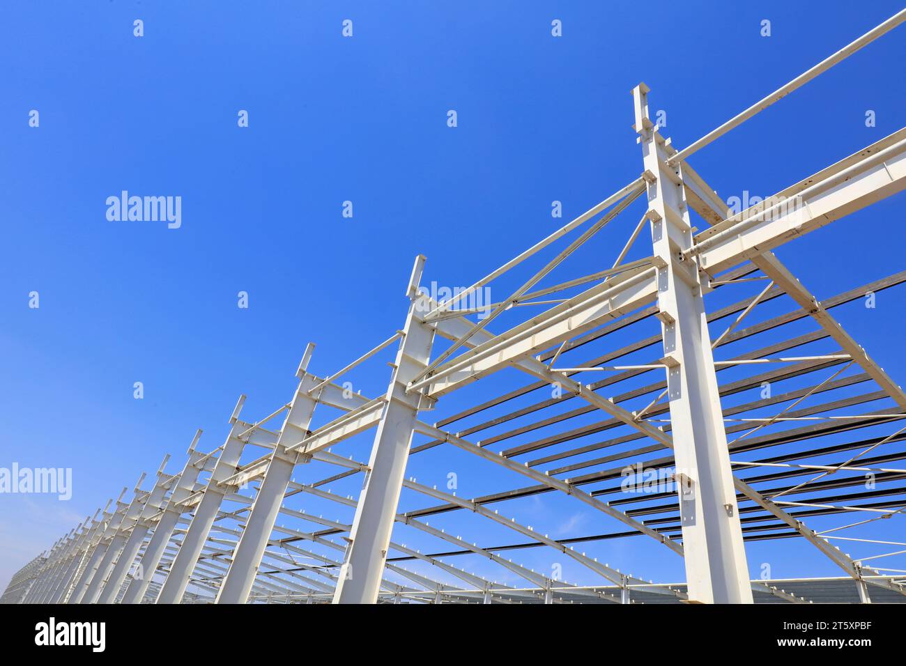 steel girder truss under blue sky, closeup of photo Stock Photo - Alamy