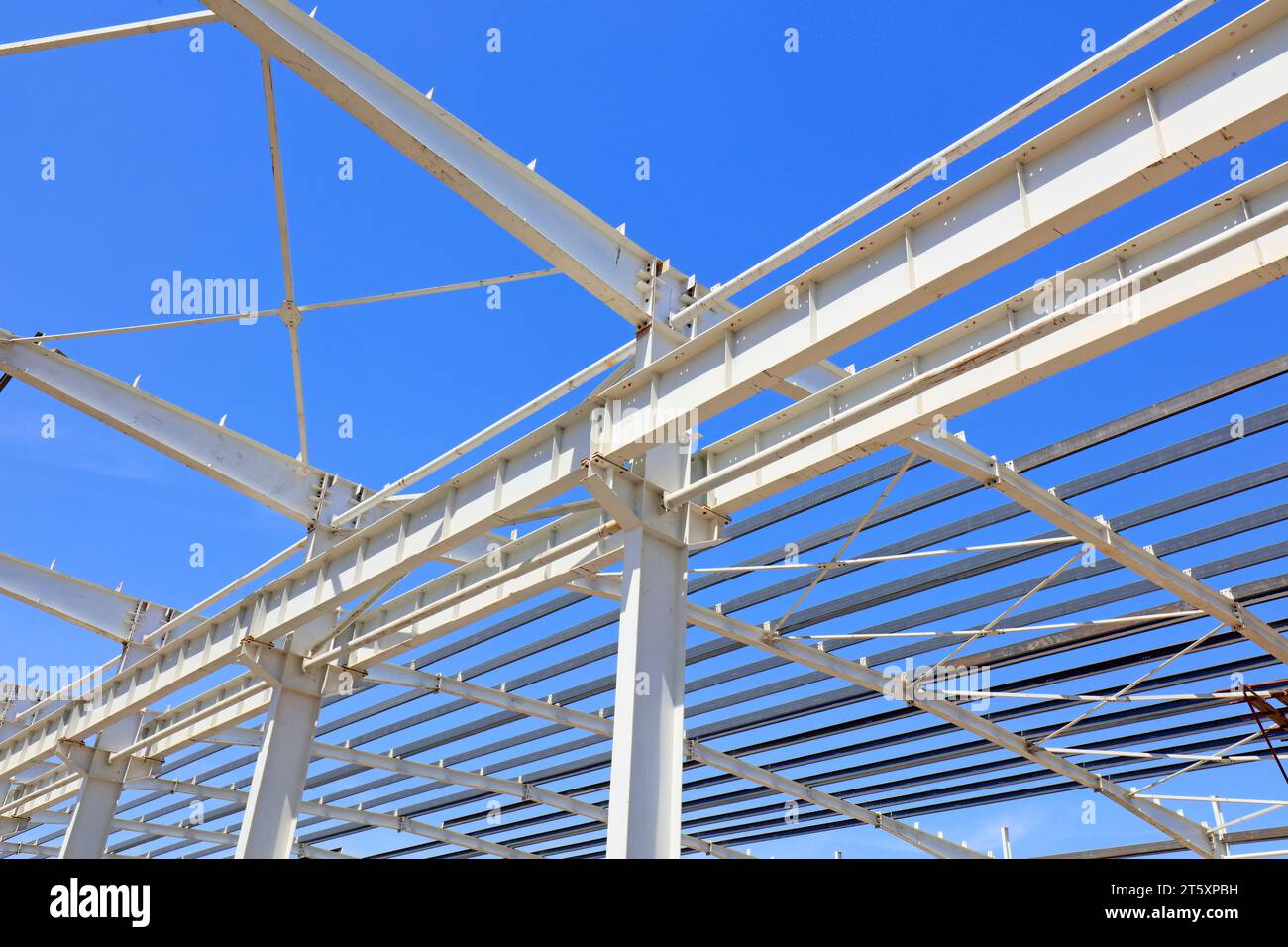 steel girder truss under blue sky, closeup of photo Stock Photo - Alamy