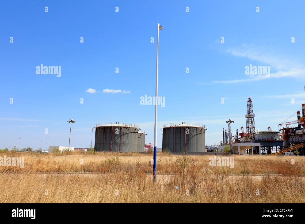 Storage tanks and drilling platforms in china Stock Photo - Alamy