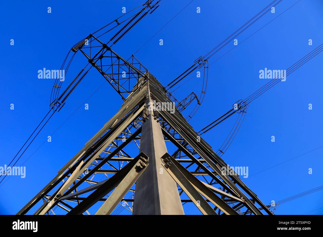 Electric power tower in blue sky Stock Photo - Alamy