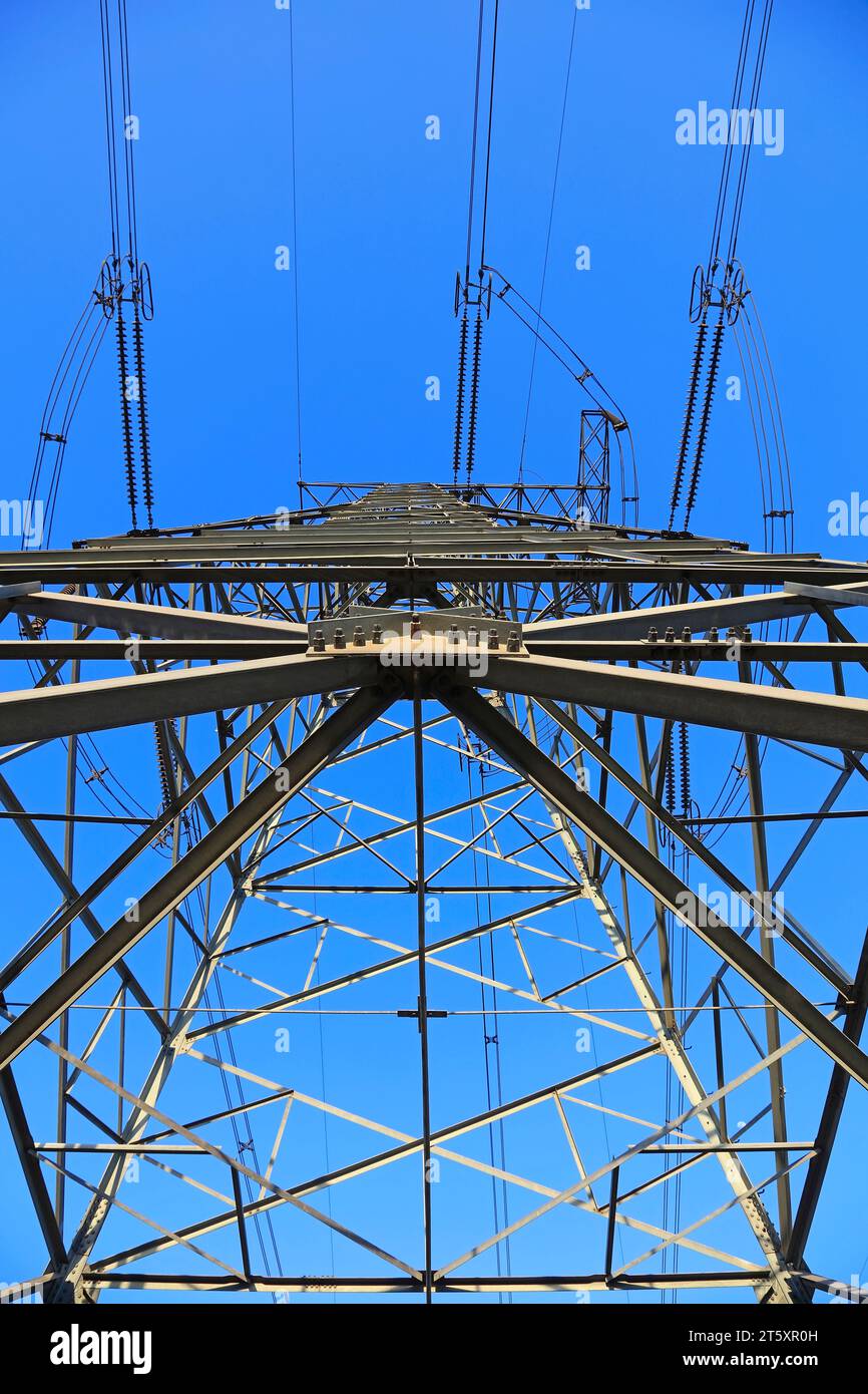 Electric power tower in blue sky Stock Photo - Alamy
