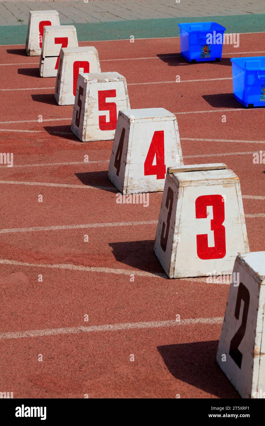 track number in the red plastic runway Stock Photo - Alamy