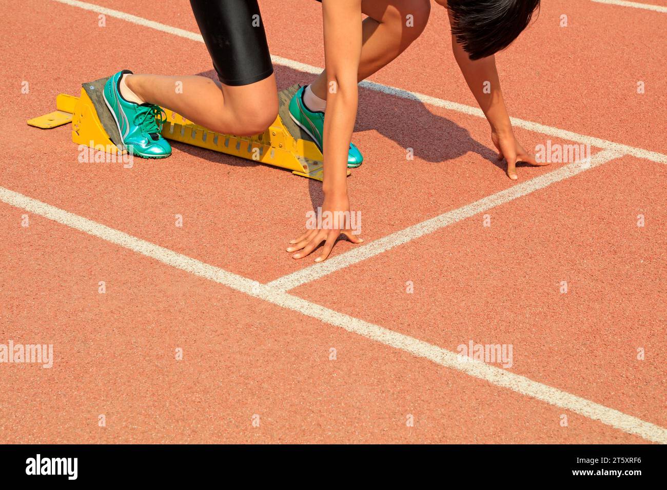 starting block and short distance runner Stock Photo - Alamy