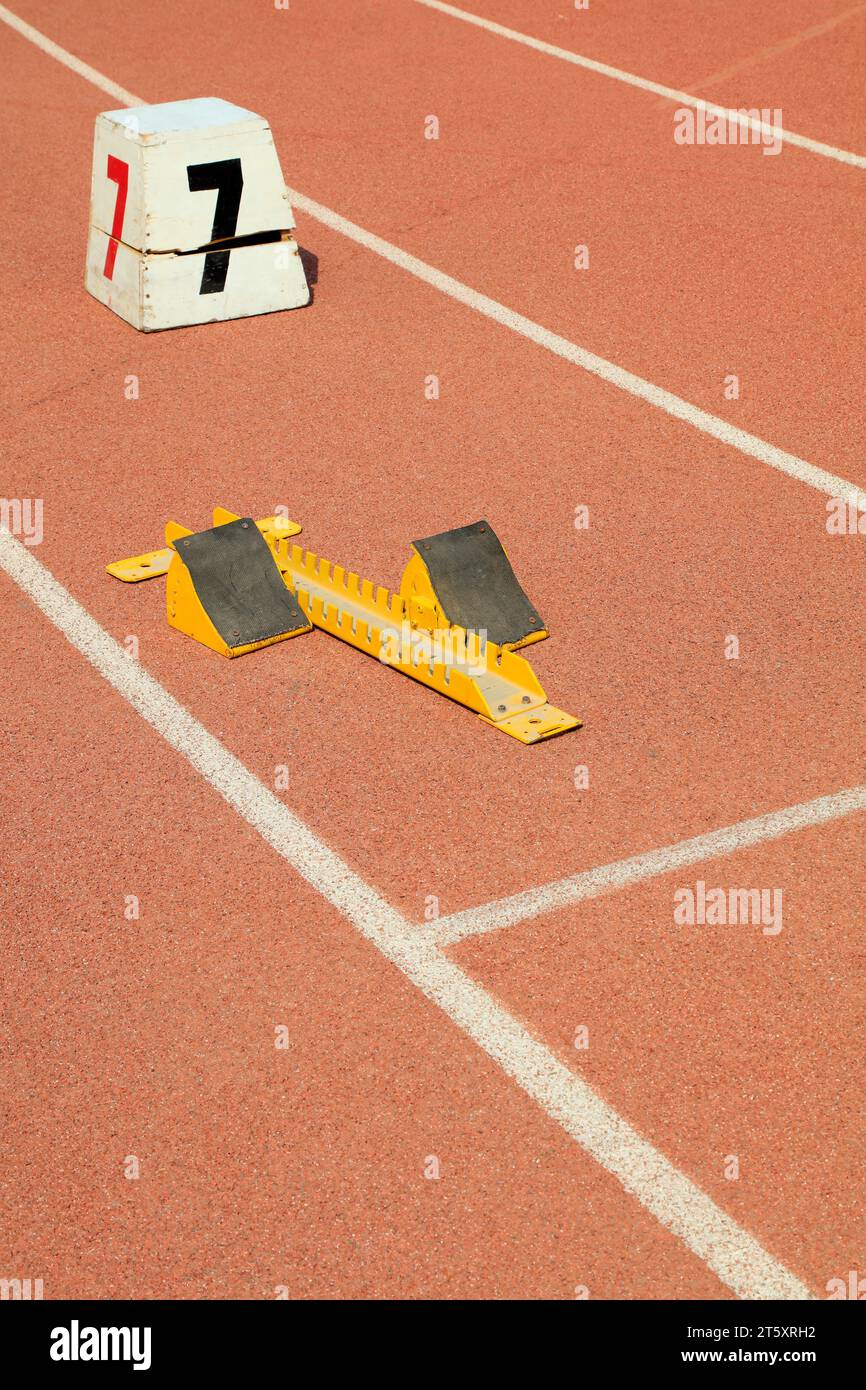 starting block and track number on plastic playground Stock Photo - Alamy