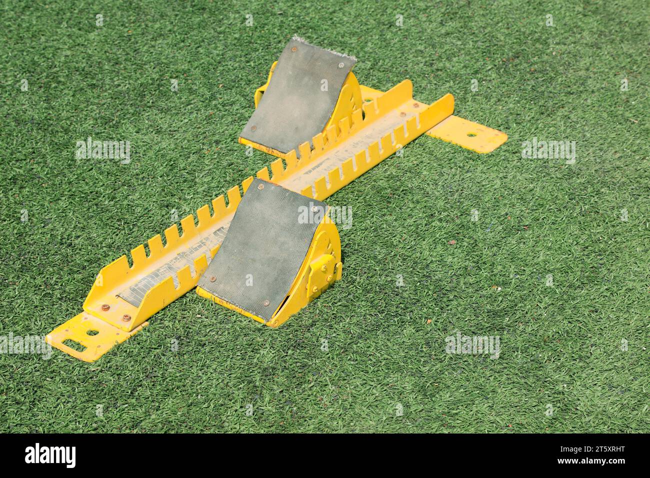 starting block in the green plastic playground Stock Photo - Alamy
