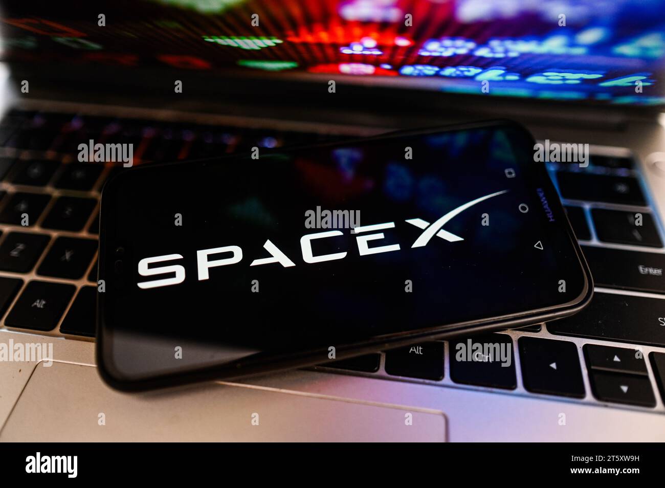 In this photo illustration, a SpaceX logo is displayed on a smartphone ...