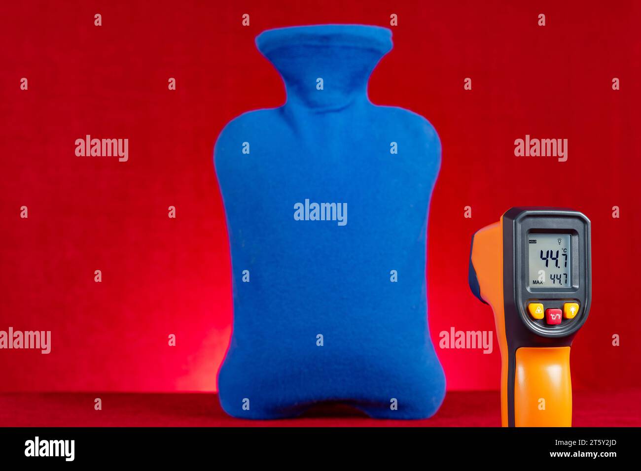 infrared thermometer shows the surface temperature of a hot water ...