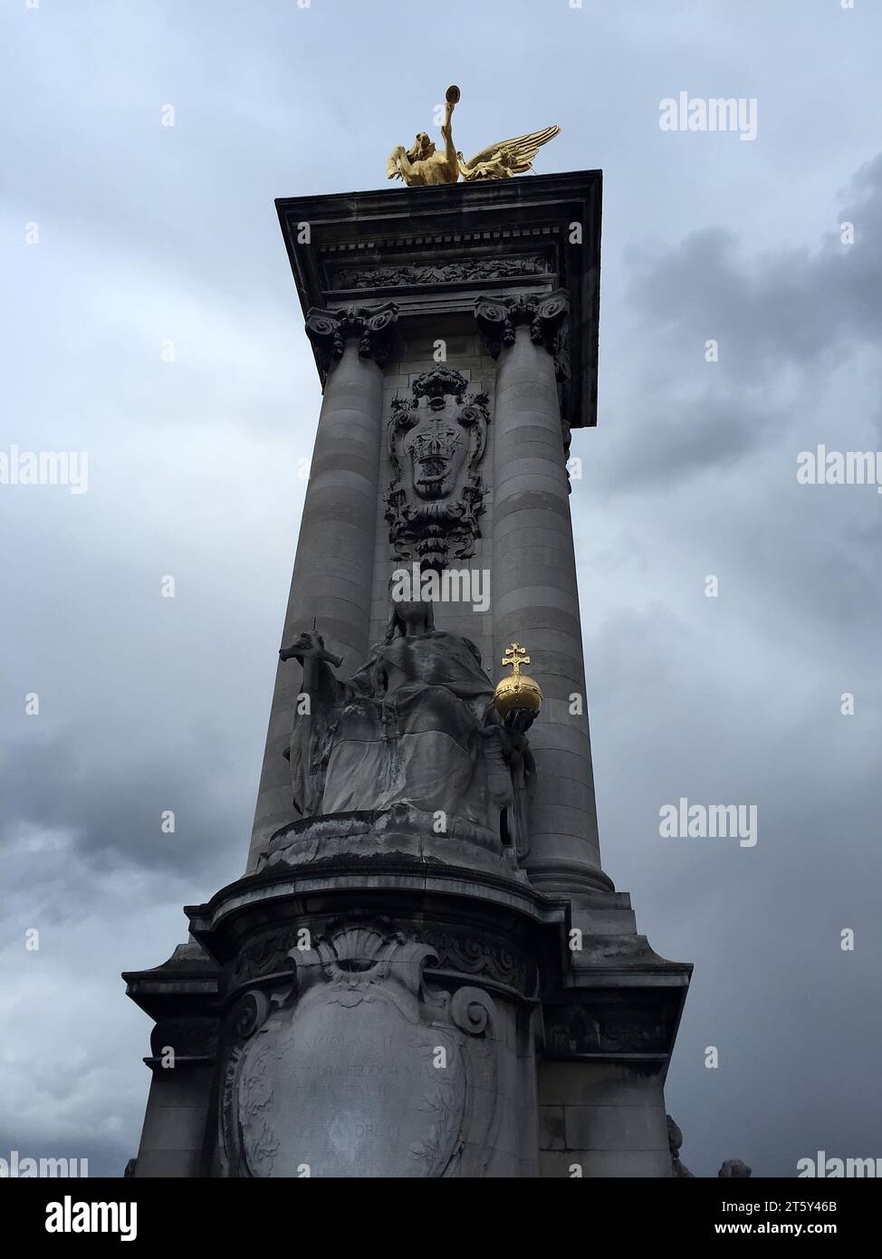 A bronze statue of knights on the pillars of the Pont Alexandre III in ...