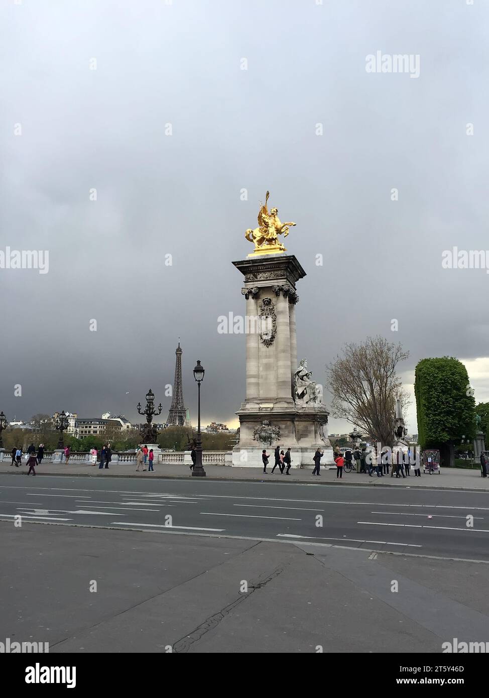 A bronze statue of knights on the pillars of the Pont Alexandre III in ...