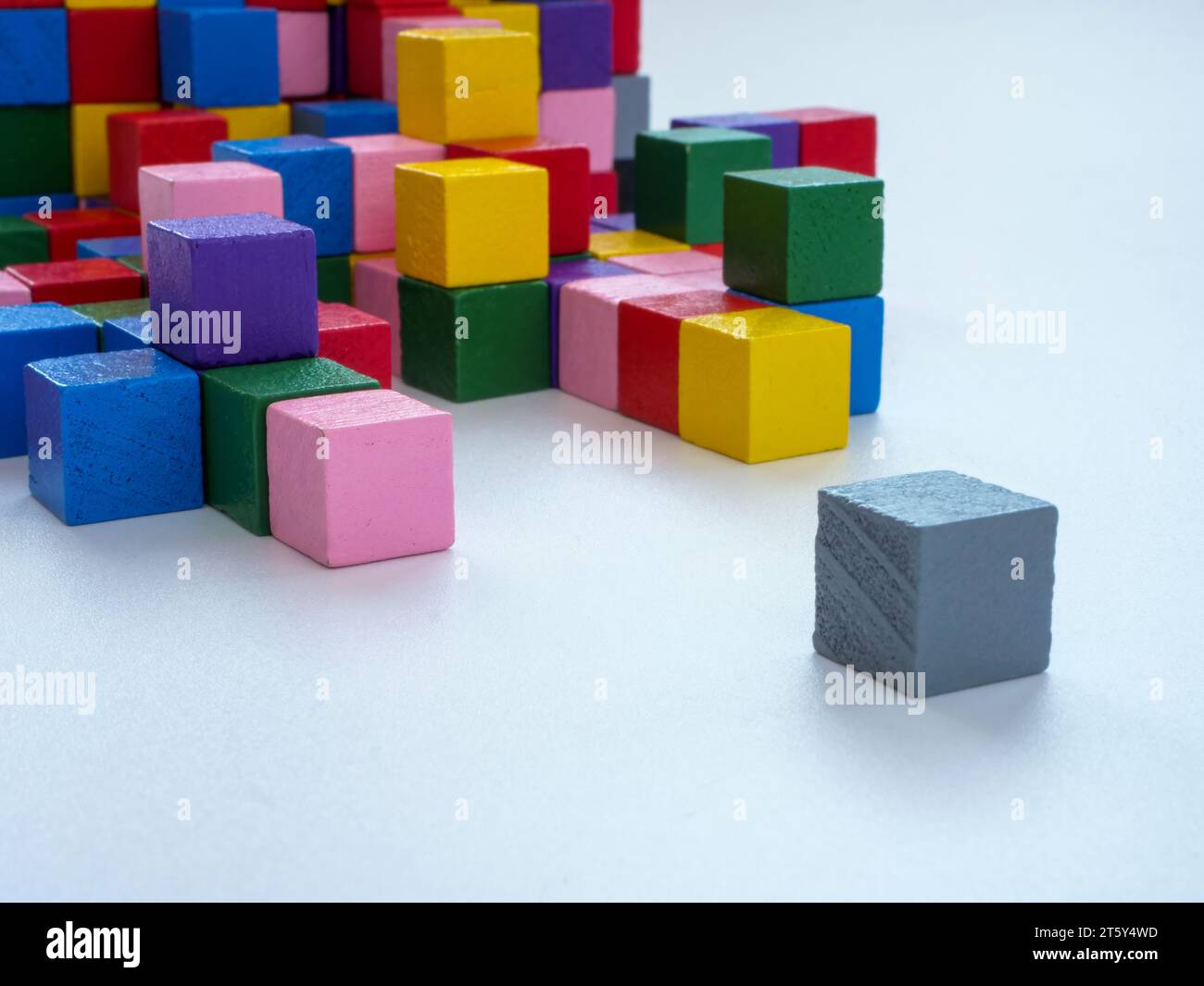 Colored cubes opposite gray. Being different or depression concept ...