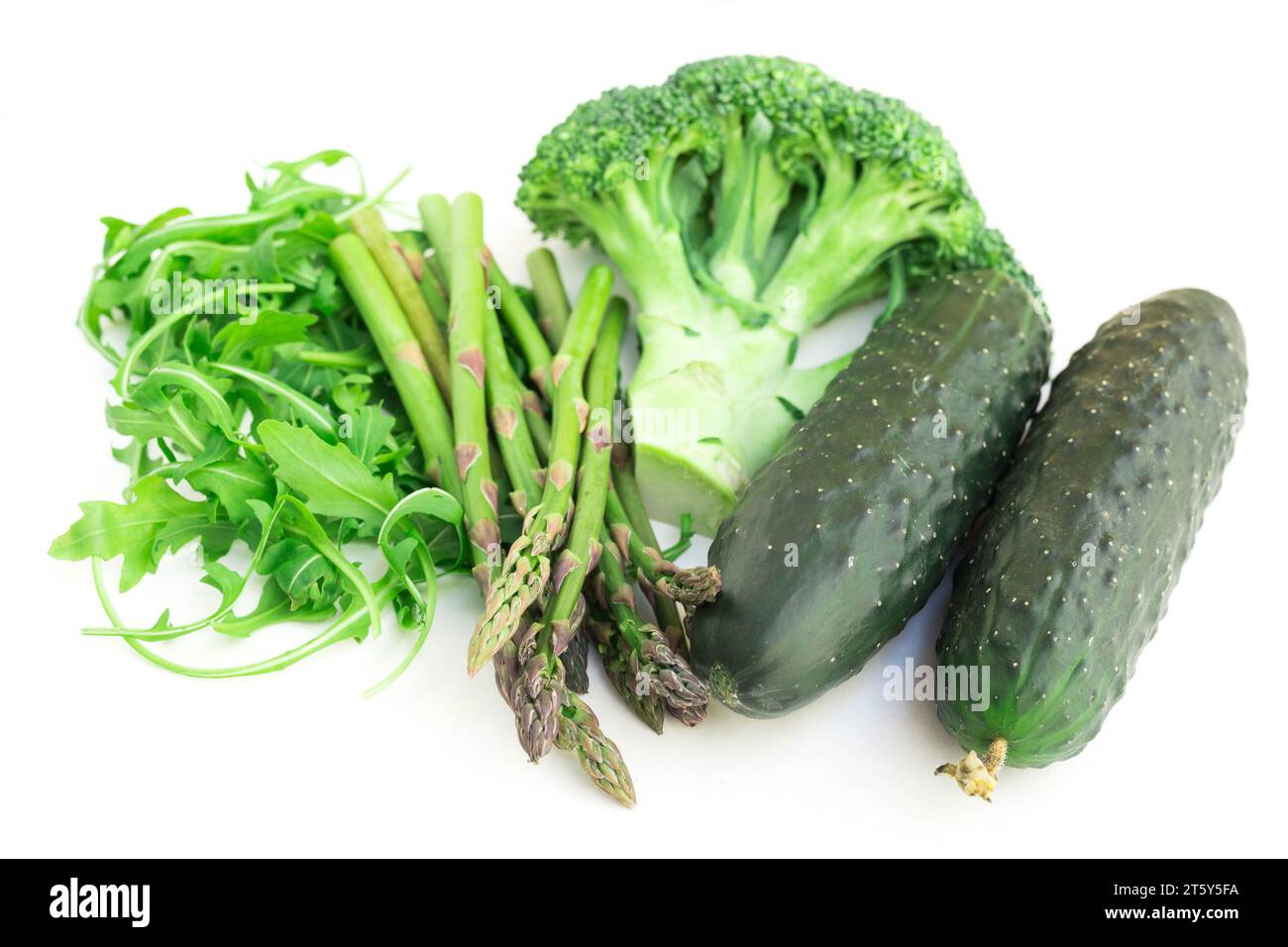 Still life from green farm vegetables, arugula, broccoli, asparagus and ...
